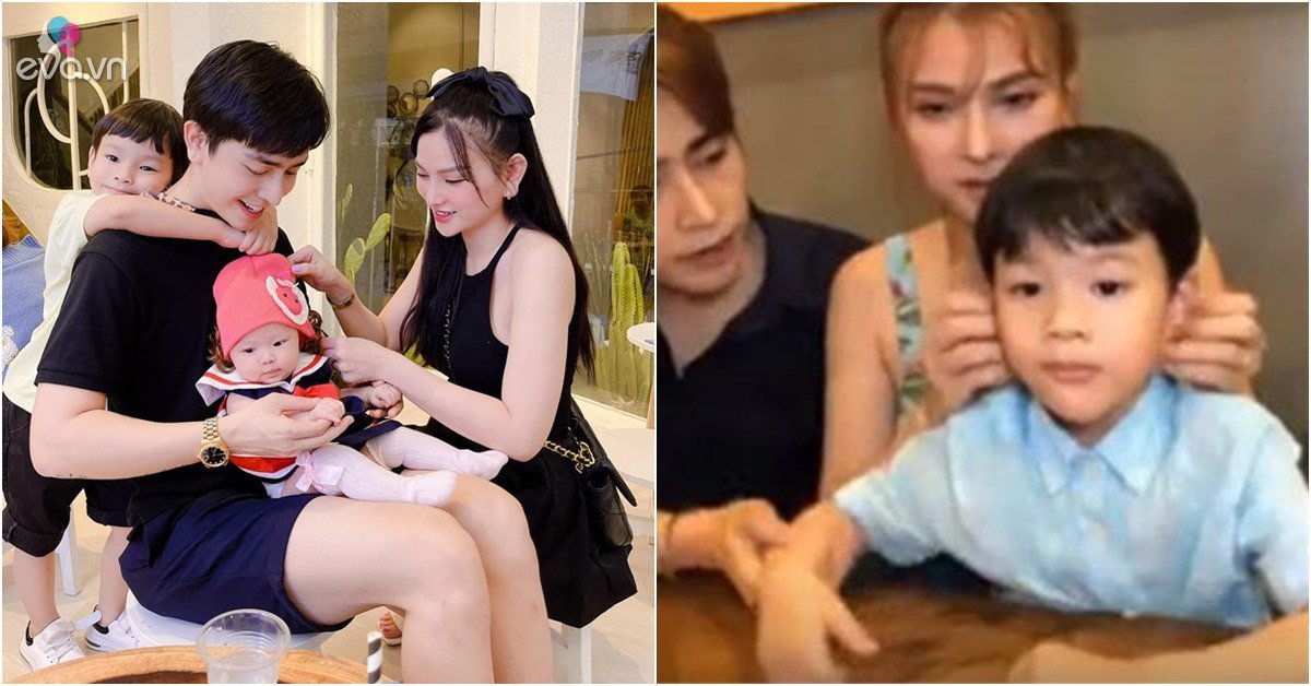 Bàn tay con trai riêng Thu Thủy ôm cổ khi bố dượng đang bế em gái gây chú ý